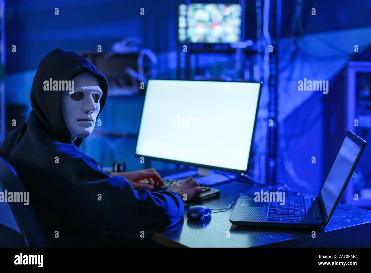 Professional hacker using computer in dark room Stock Photo - Alamy