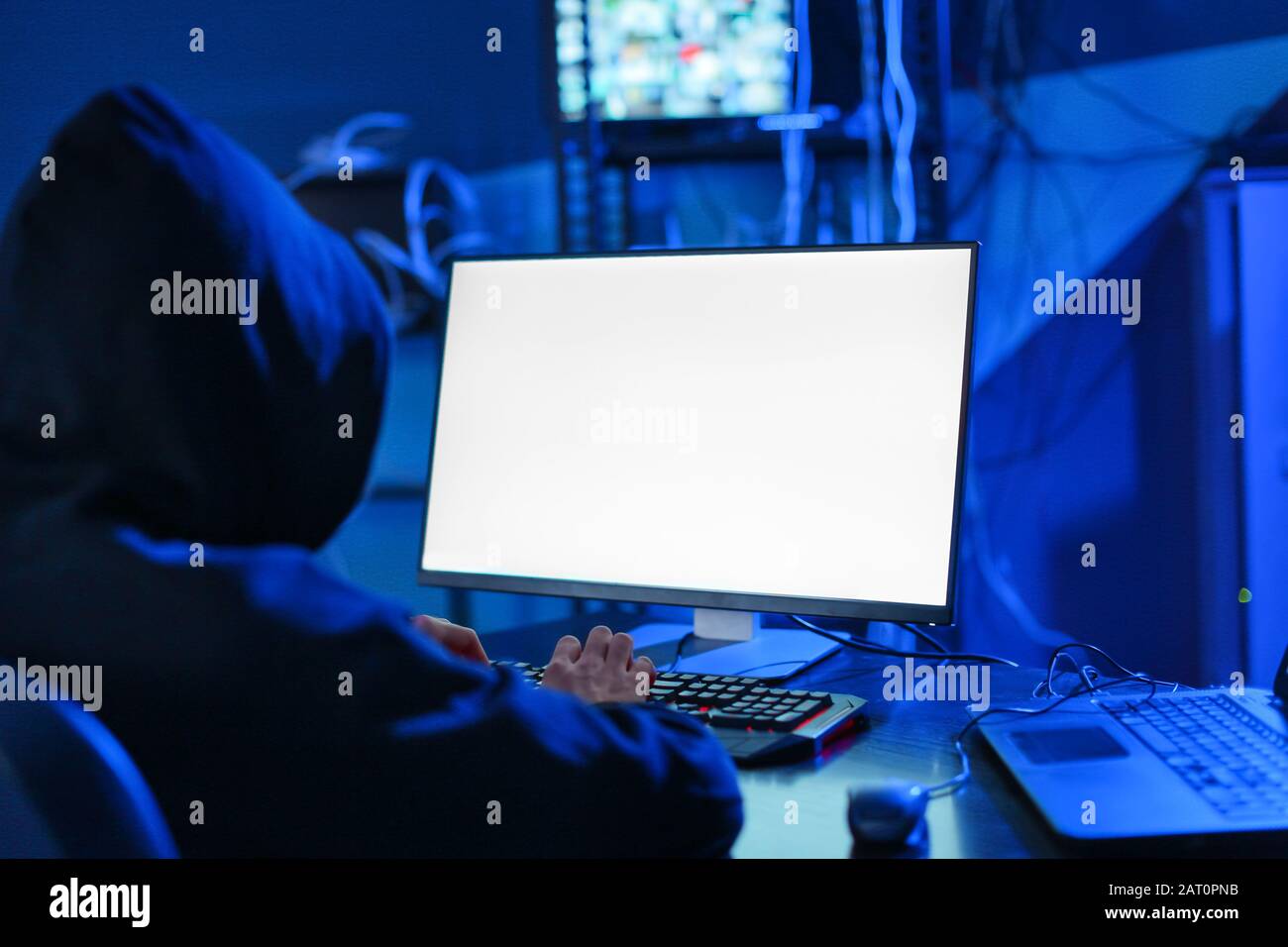 Professional hacker using computer in dark room Stock Photo - Alamy