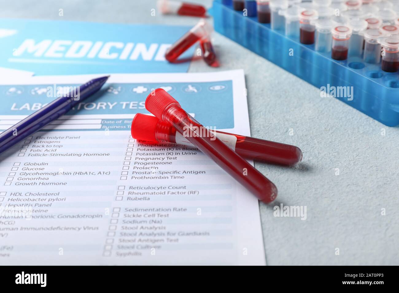 Laboratory test form and blood samples on table Stock Photo - Alamy