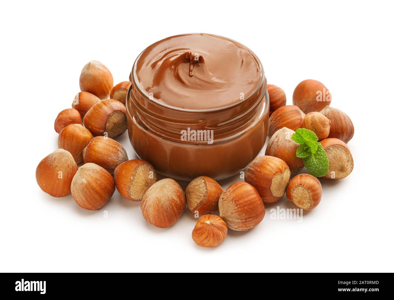 Tasty chocolate paste with hazelnuts on white background Stock Photo ...