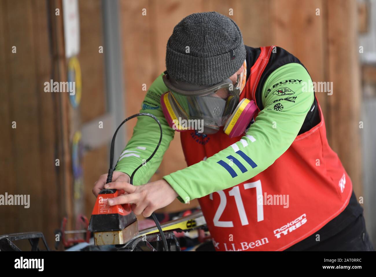Wax technician wears full-face respirator to protect himself during ...