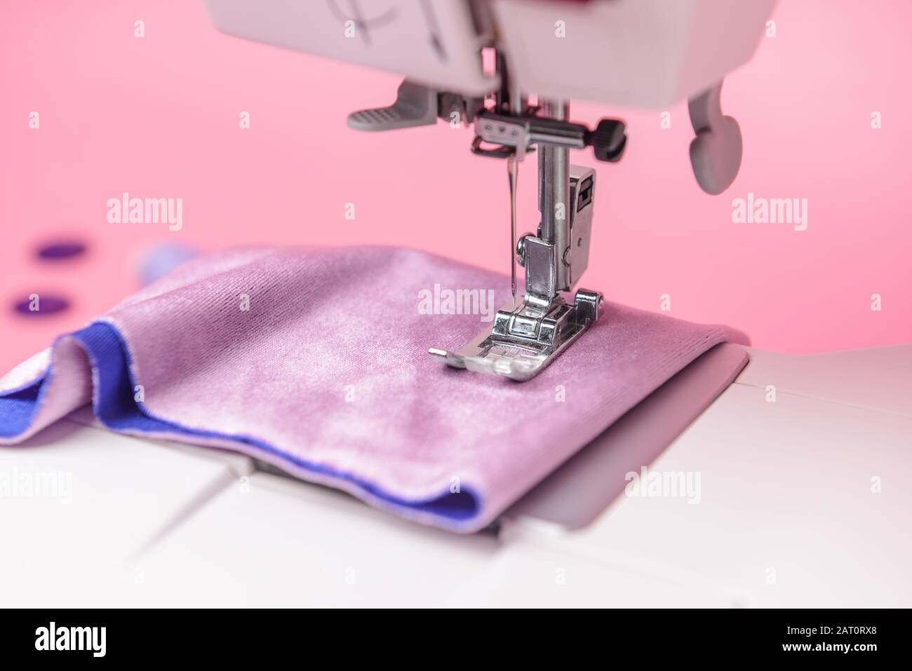 Sewing machine with cloth on color background, closeup Stock Photo - Alamy