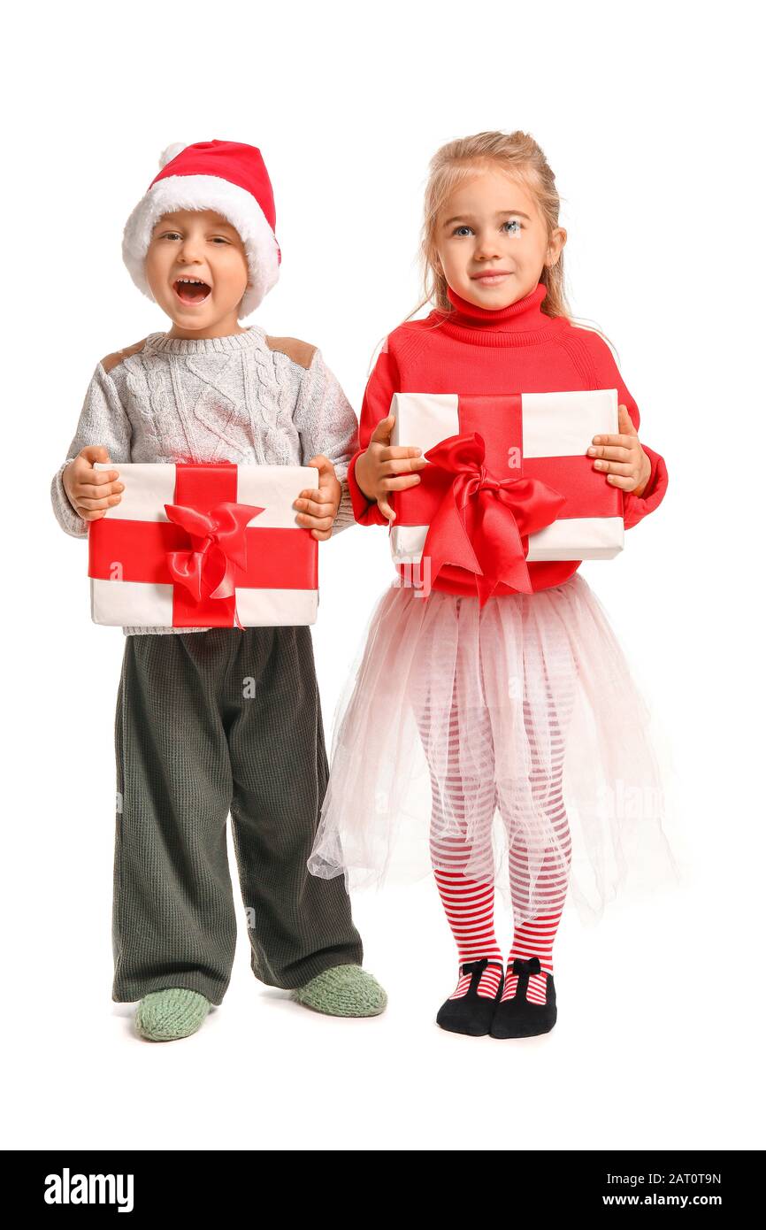 Cute little children with Christmas gifts on white background Stock ...