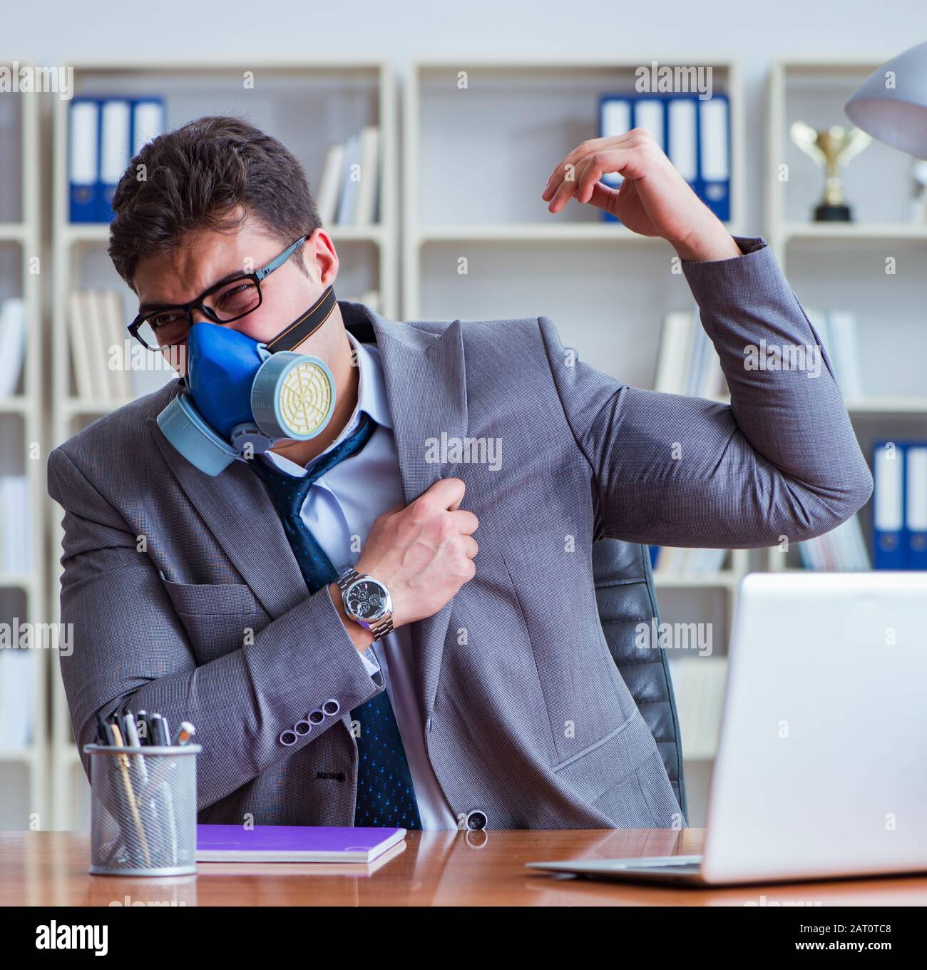 Businessman sweating excessively smelling bad in office at workplace ...