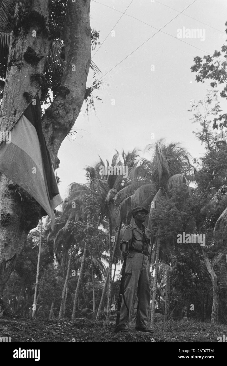 Gombong A KNIL soldier is on guard by a tree with the Dutch flag Date ...