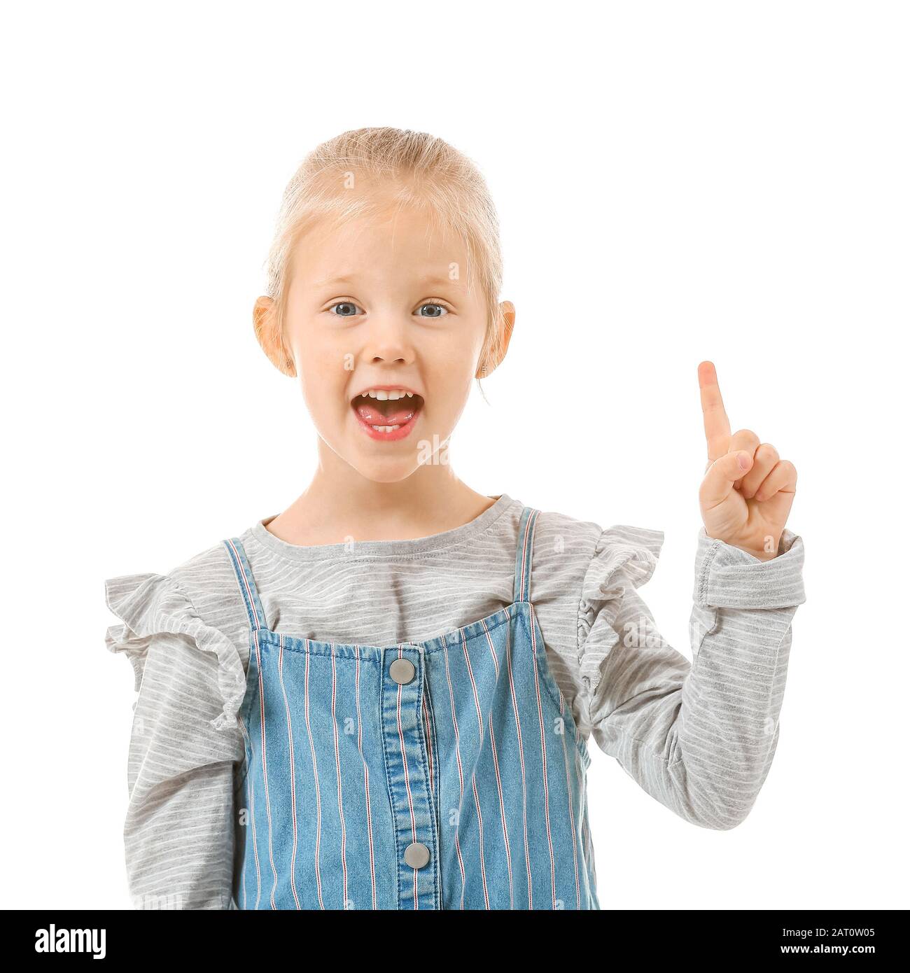 Cute little girl with raised index finger on white background Stock ...