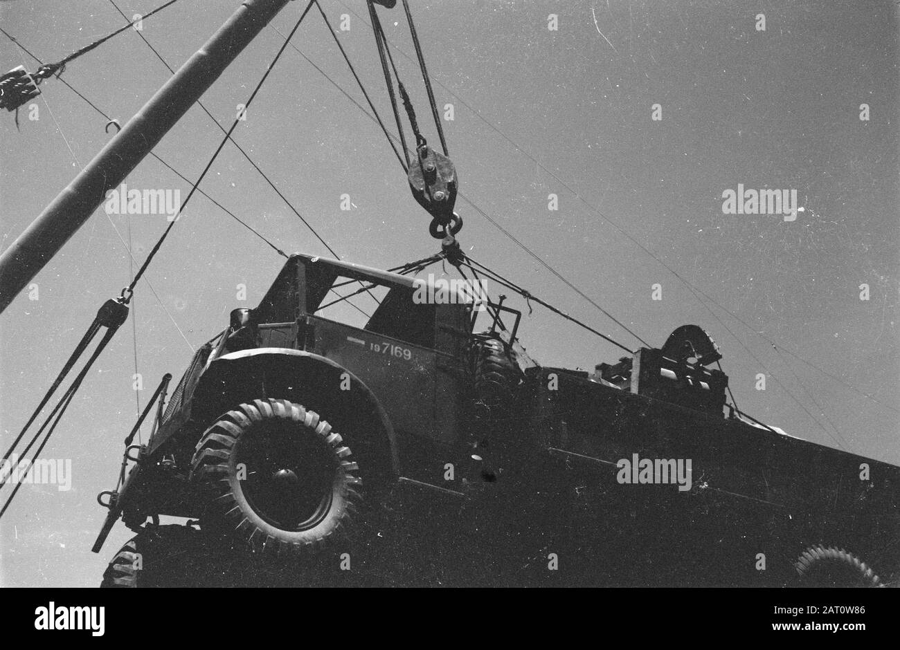 Makassar. Displacement KNIL An army truck is loaded aboard the troop ...