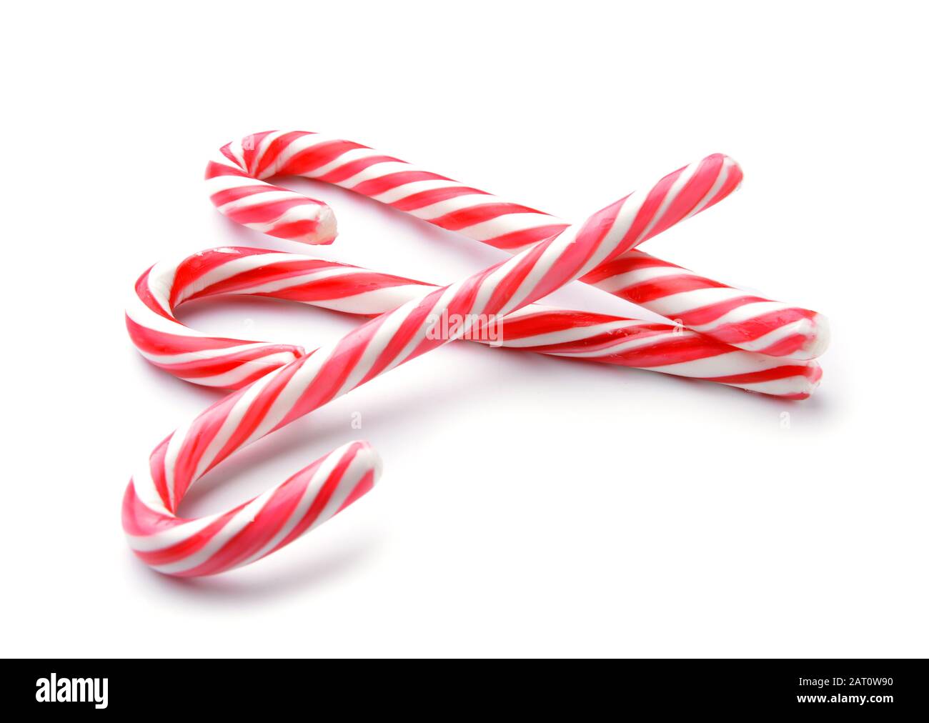 Candy canes on white background Stock Photo - Alamy