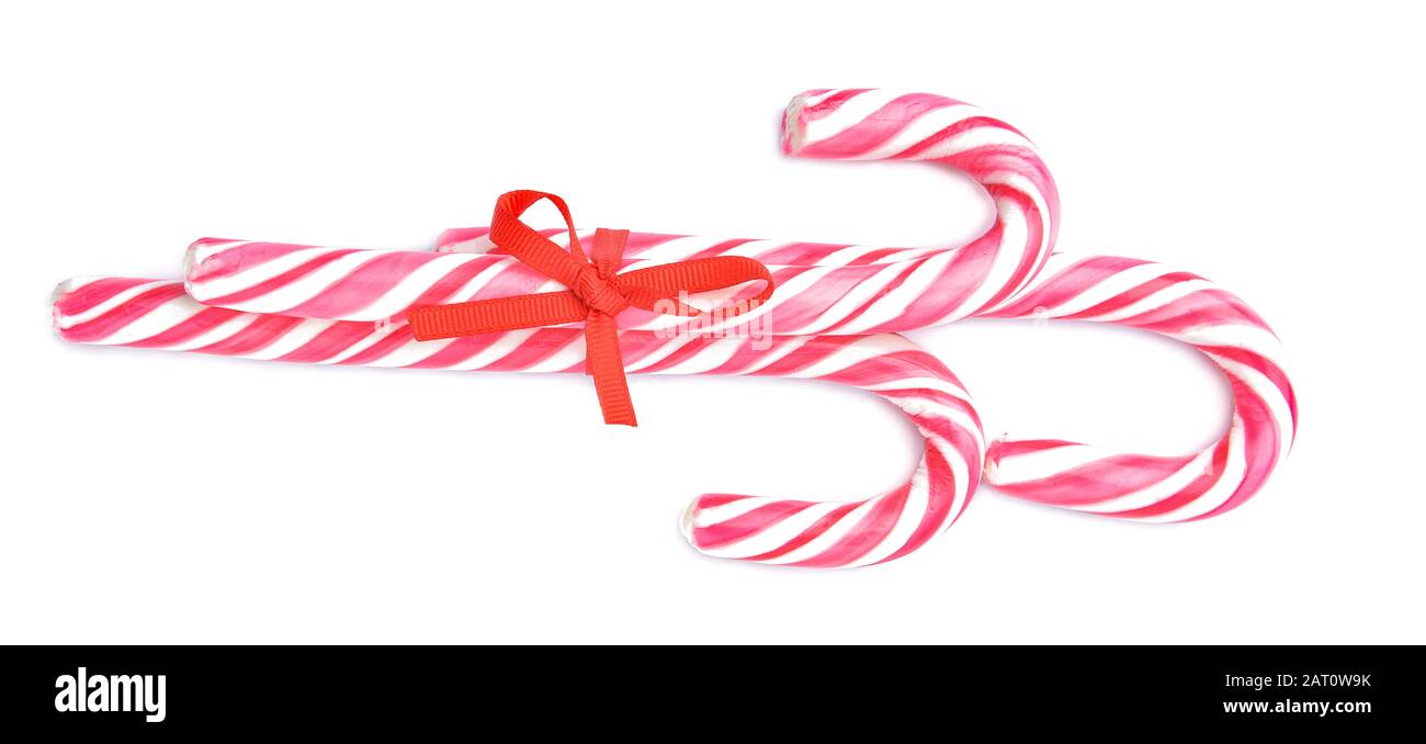 Candy canes on white background Stock Photo - Alamy