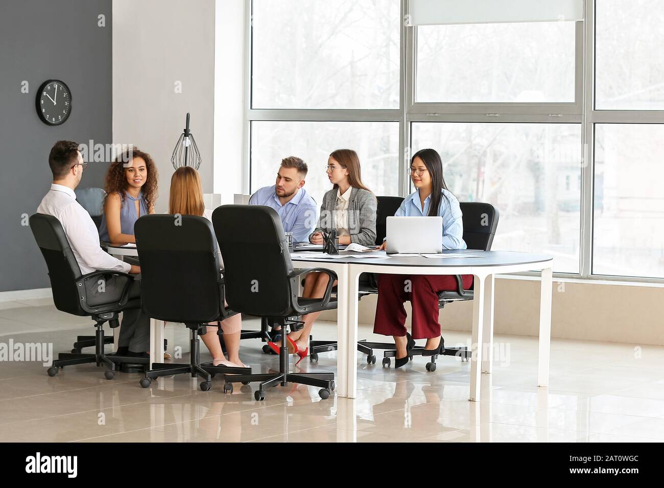 Colleagues discussing issue at business meeting in office Stock Photo ...