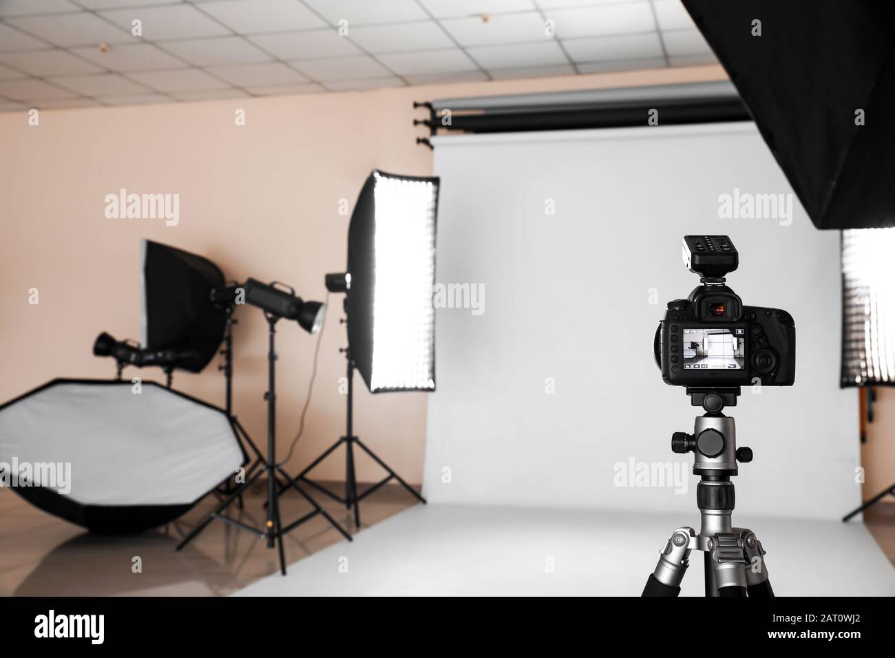 Modern photo camera in professional studio Stock Photo - Alamy