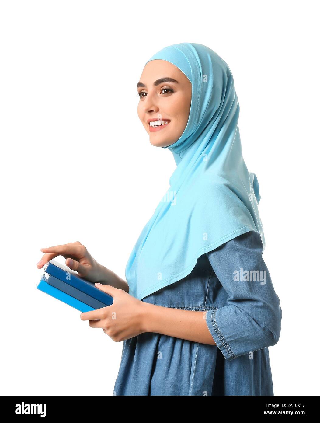 Female Muslim student on white background Stock Photo - Alamy