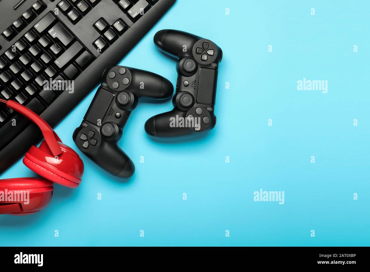 Modern gaming accessories on color background Stock Photo - Alamy