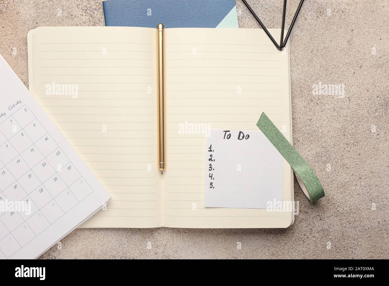 Empty to do list with notebook on table Stock Photo - Alamy