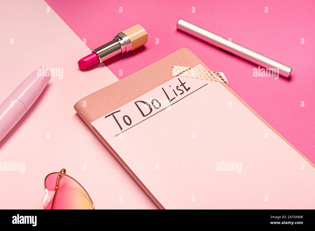 Empty to do list with makeup cosmetics on color background Stock Photo ...