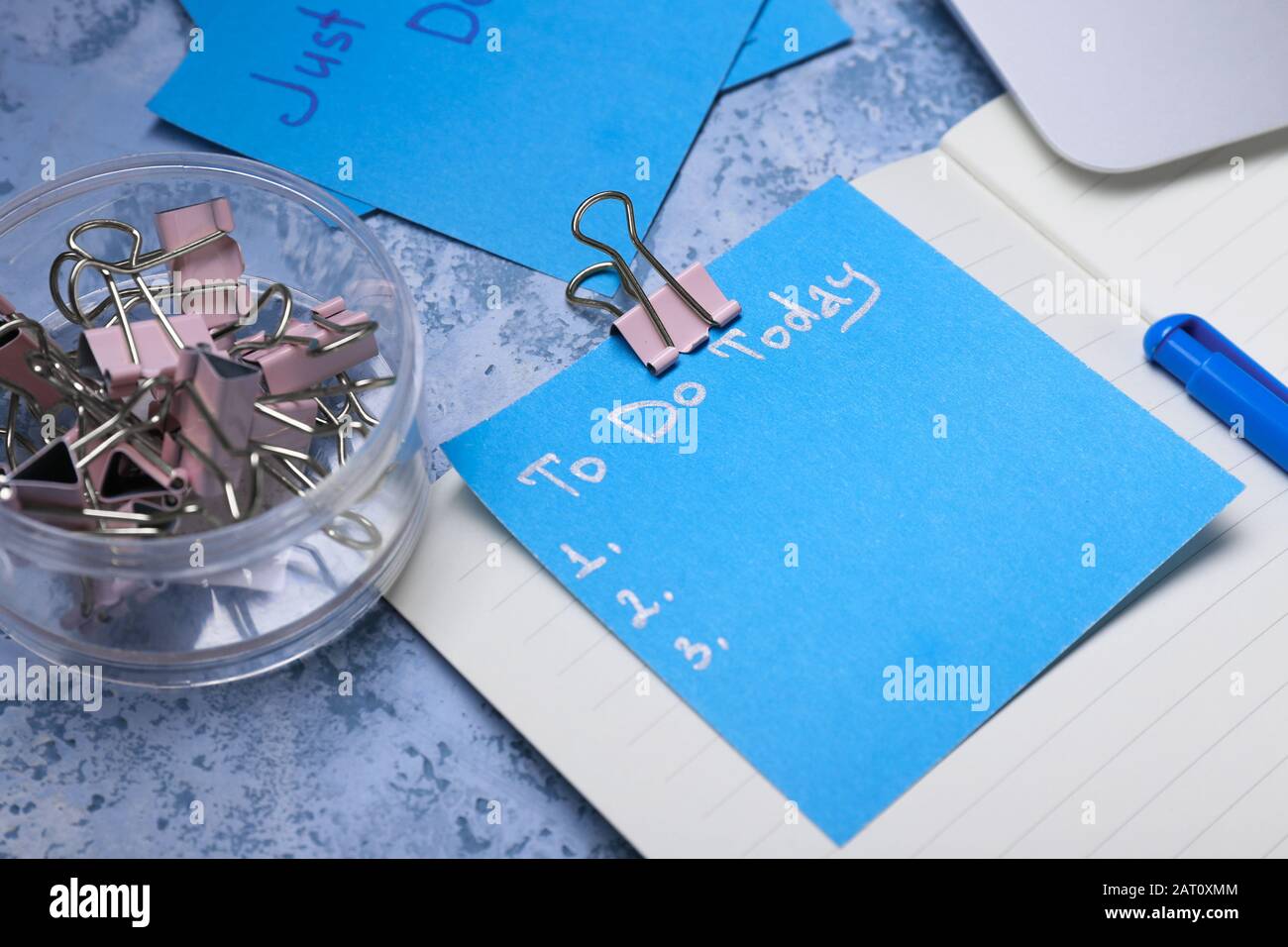Empty to do list with stationery on color background Stock Photo - Alamy