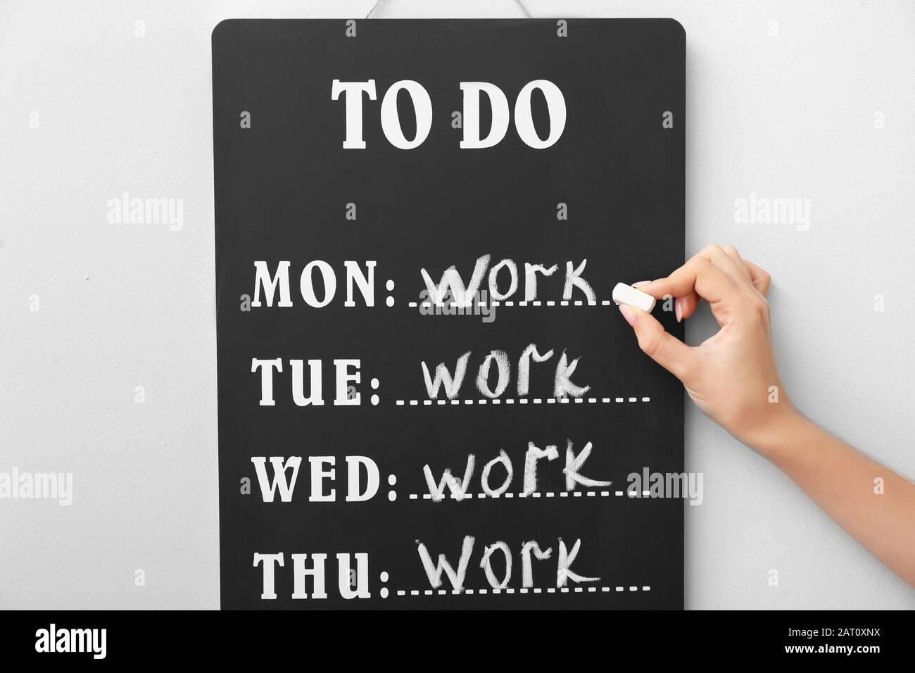 Woman making to do list on white background Stock Photo - Alamy