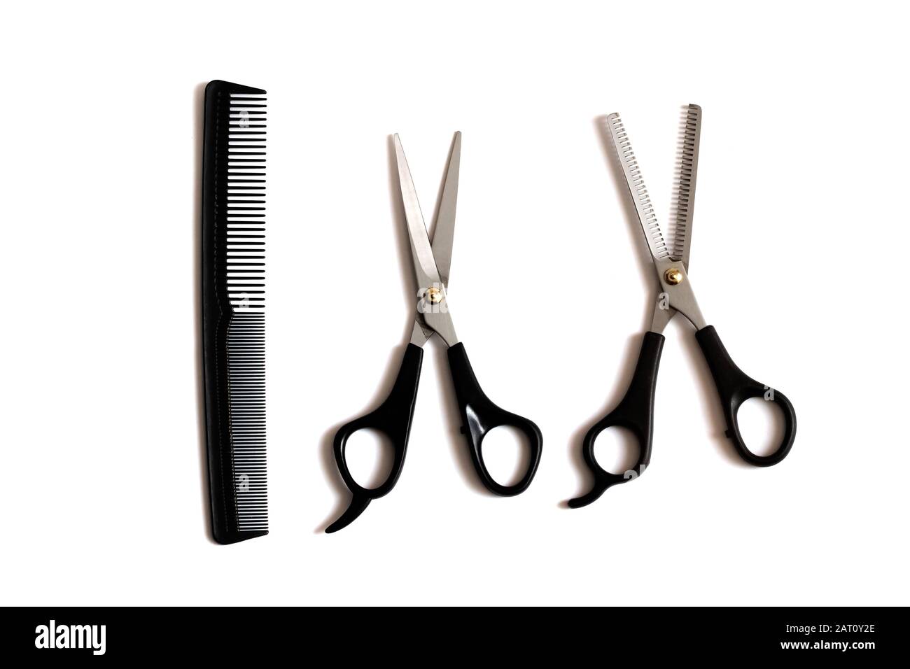 Professional hairdresser scissors and comb isolated on white background ...