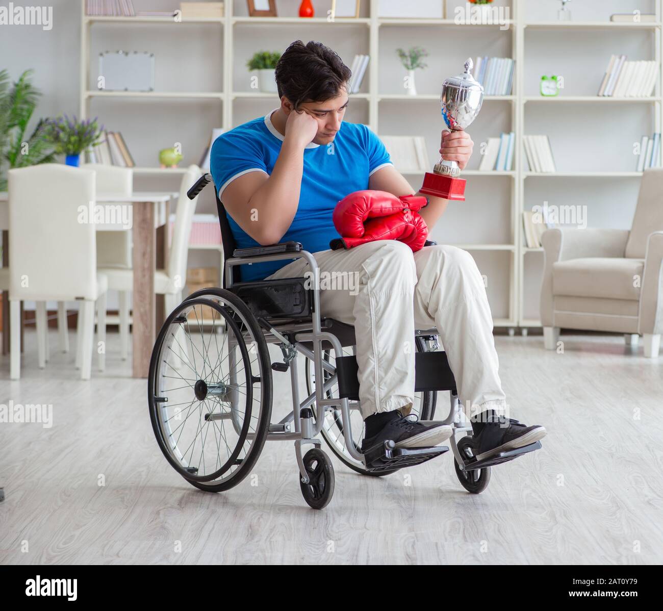 The disabled boxer at wheelchair recovering from injury Stock Photo - Alamy