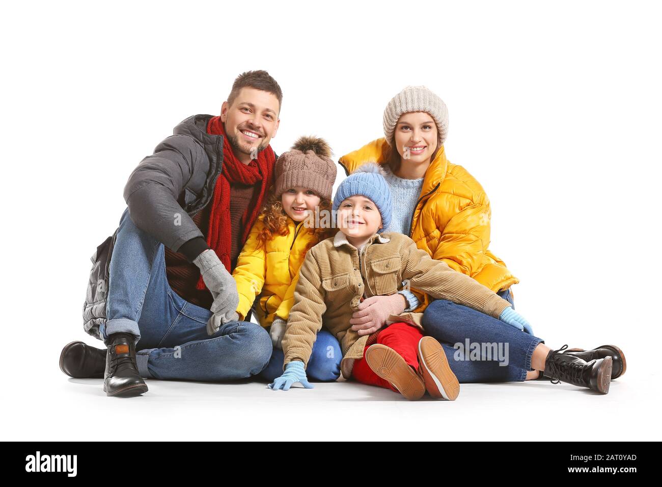 Happy family in winter clothes on white background Stock Photo - Alamy