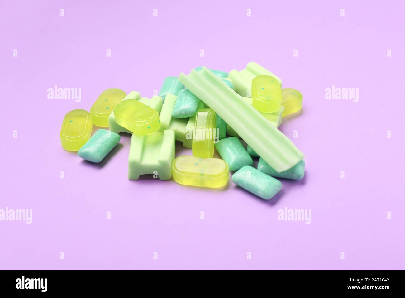 Different chewing gums on color background Stock Photo - Alamy