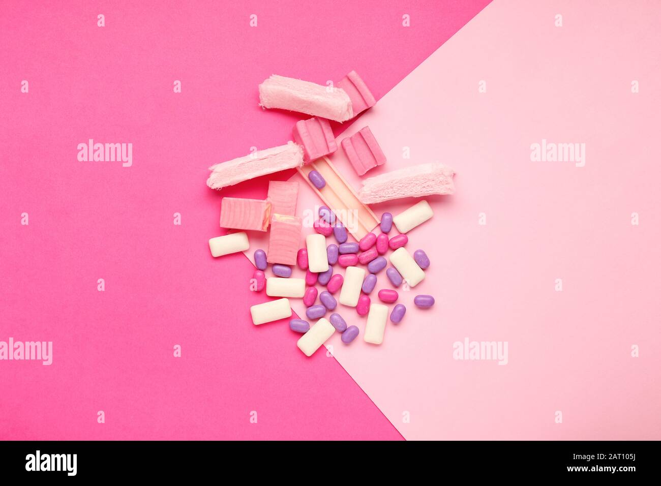 Different chewing gums on color background Stock Photo - Alamy