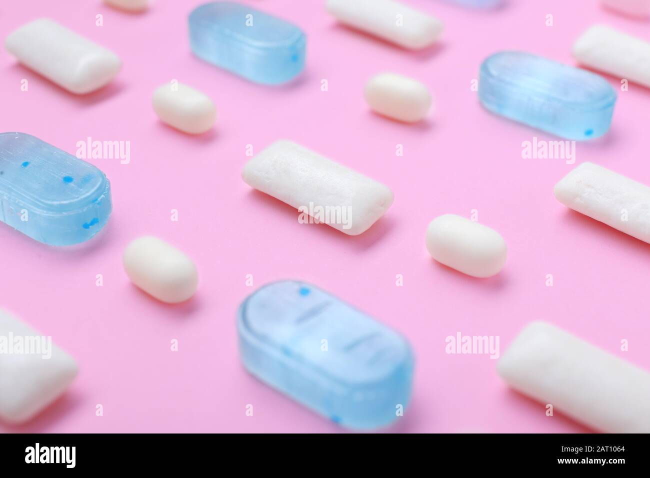 Different chewing gums on color background Stock Photo - Alamy