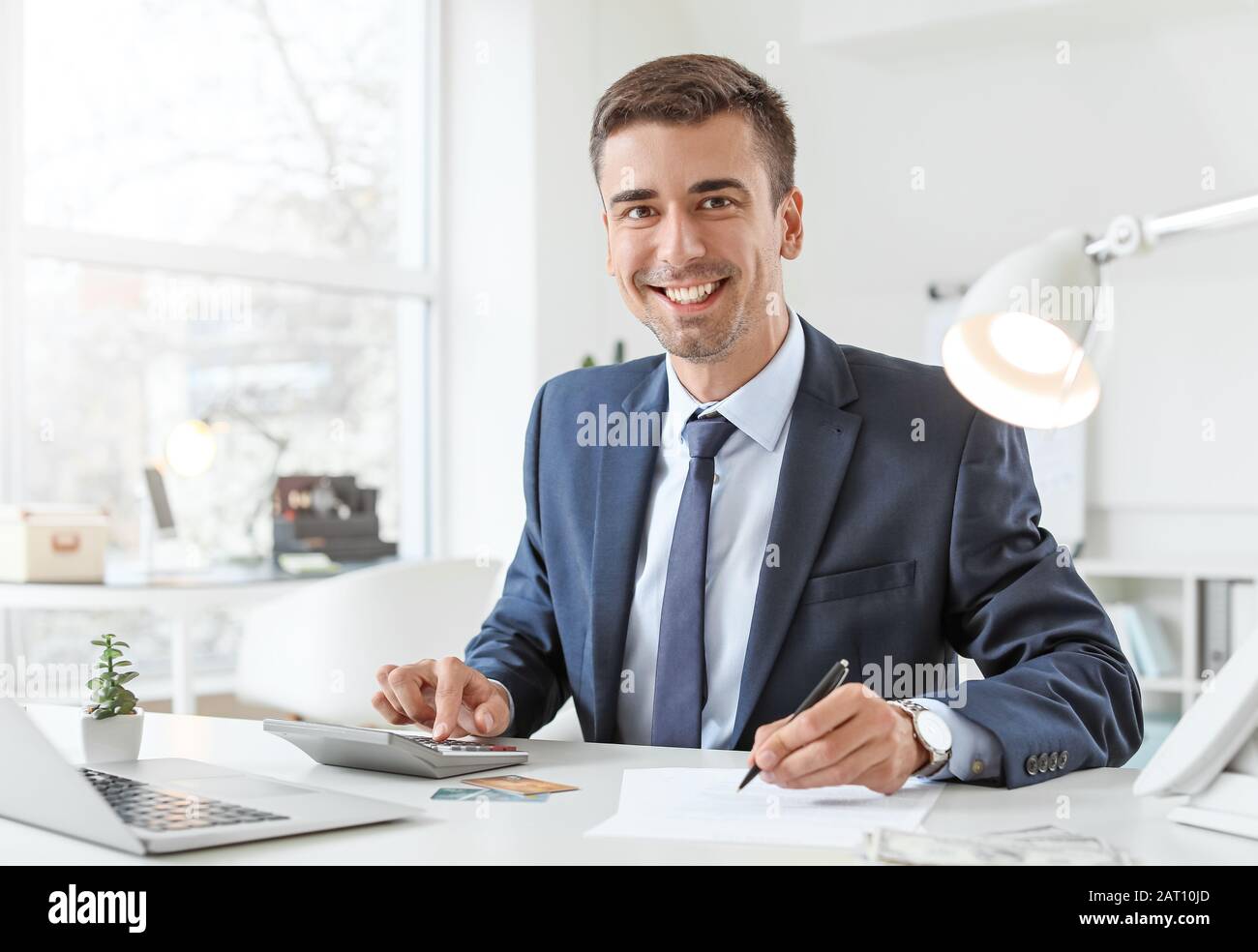 Male bank manager working in office Stock Photo - Alamy