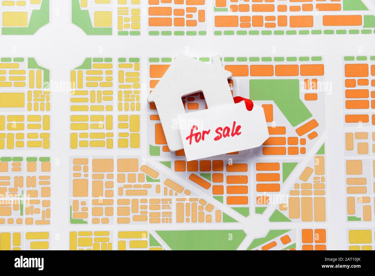 Figure of house on city map. Concept of buying real estate Stock Photo ...