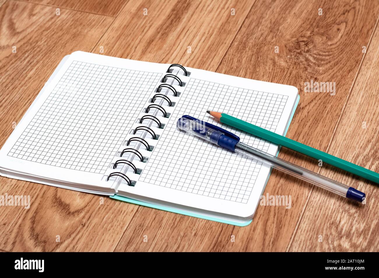 Open notebook, pen and pencil close up Stock Photo - Alamy