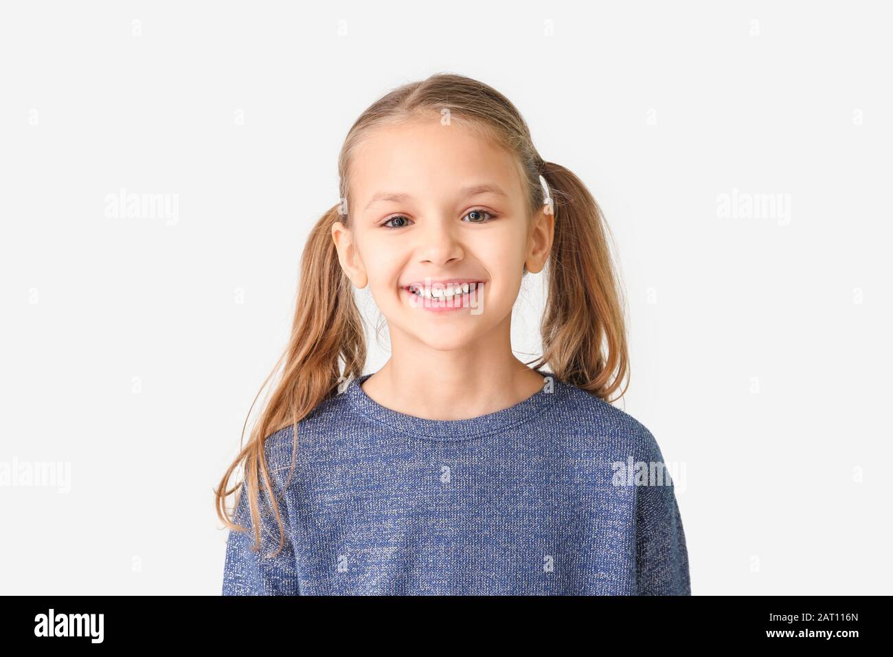 Cute little girl on white background Stock Photo - Alamy