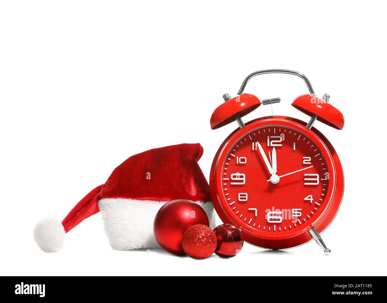 Alarm clock, decor and Santa hat on white background. Christmas ...
