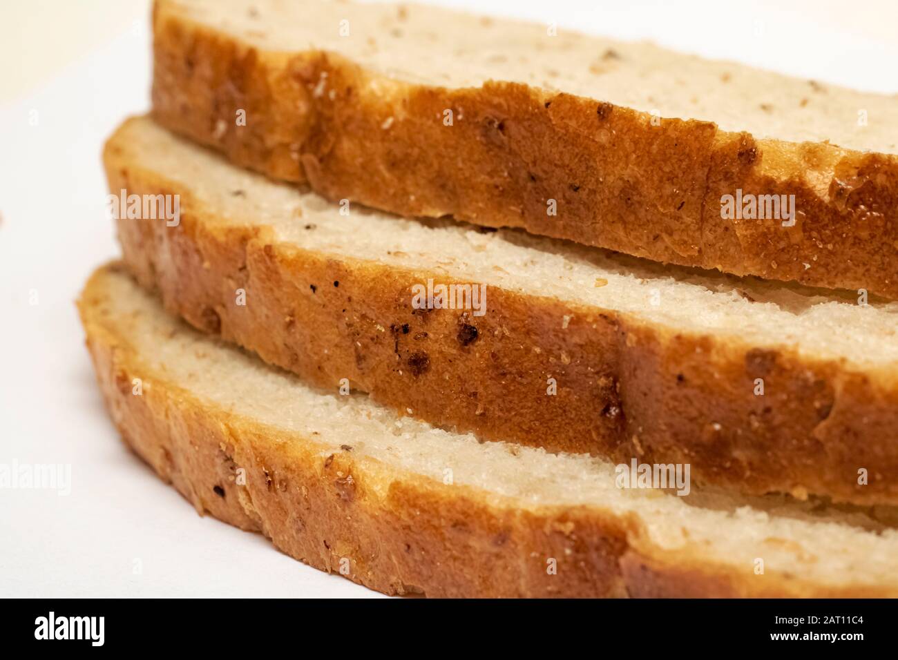 Three slices of bread on a white background Stock Photo - Alamy