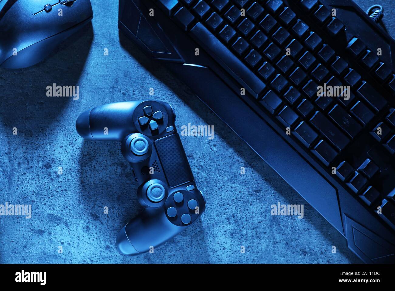Modern gaming accessories on dark background Stock Photo - Alamy