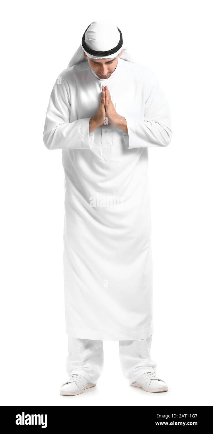 Handsome praying Arab man on white background Stock Photo - Alamy