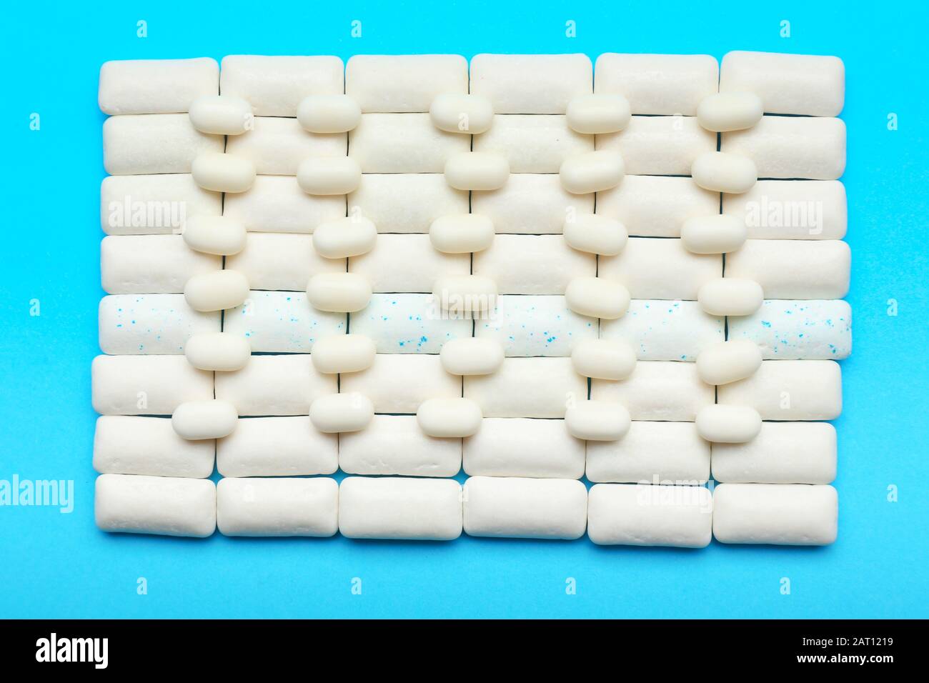 Different chewing gums on color background Stock Photo - Alamy