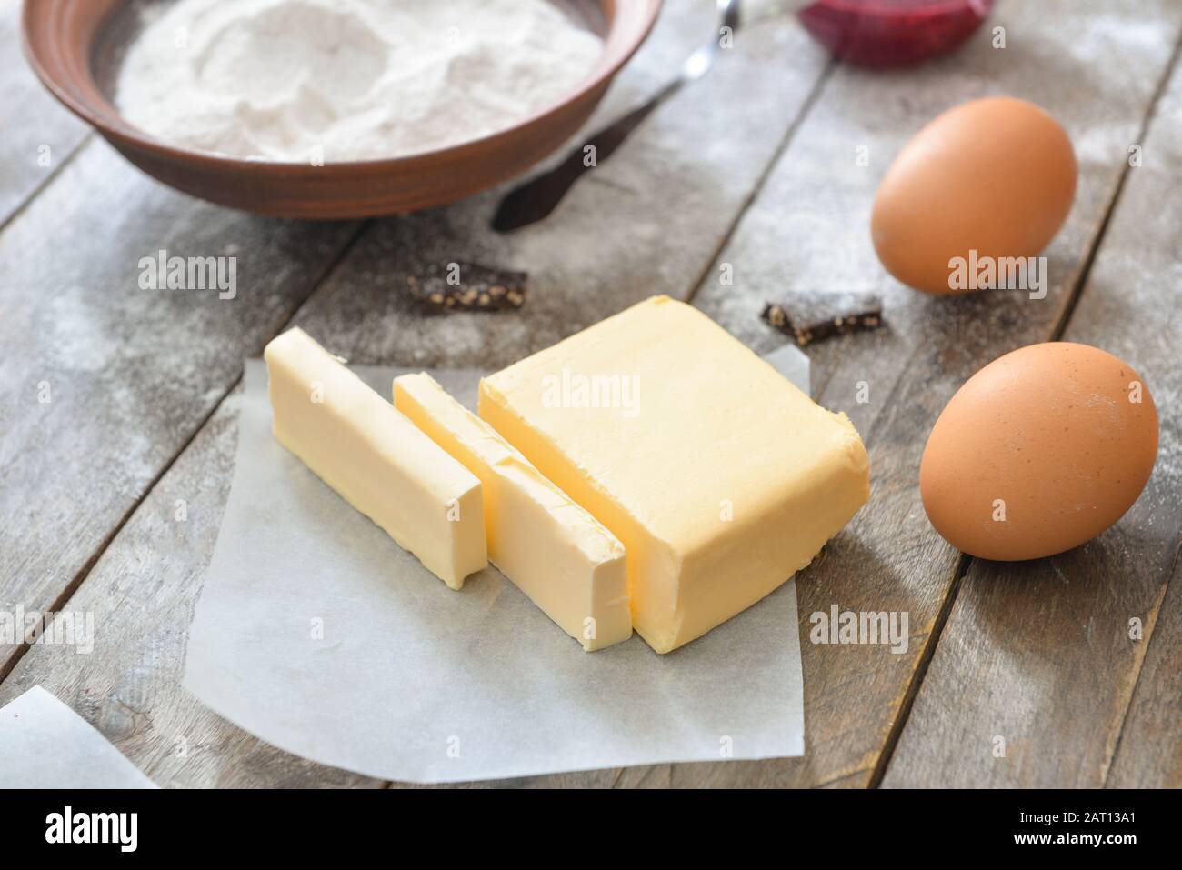 Fresh butter with products on wooden table Stock Photo - Alamy