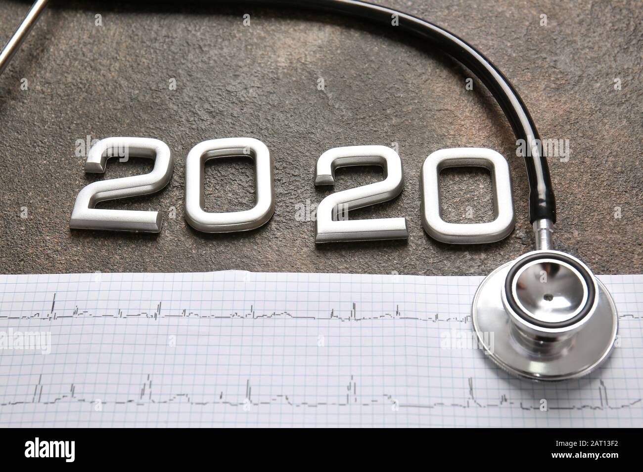 Stethoscope, figure 2020 and cardiogram on dark background Stock Photo ...