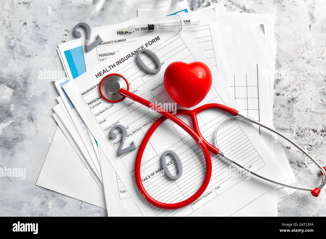 Stethoscope, figure 2020 and documents on white background Stock Photo ...