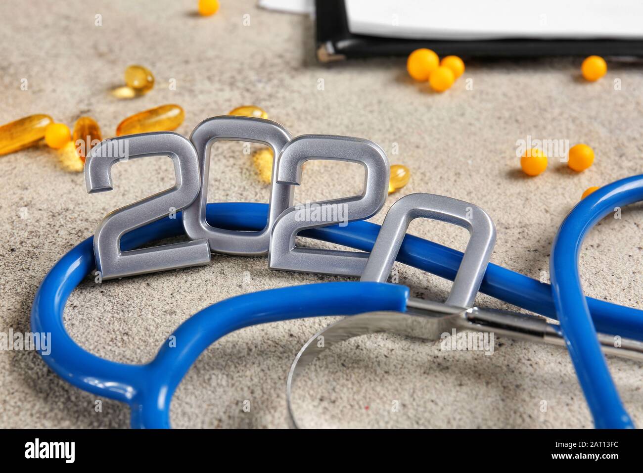 Stethoscope and figure 2020 on grey background Stock Photo - Alamy
