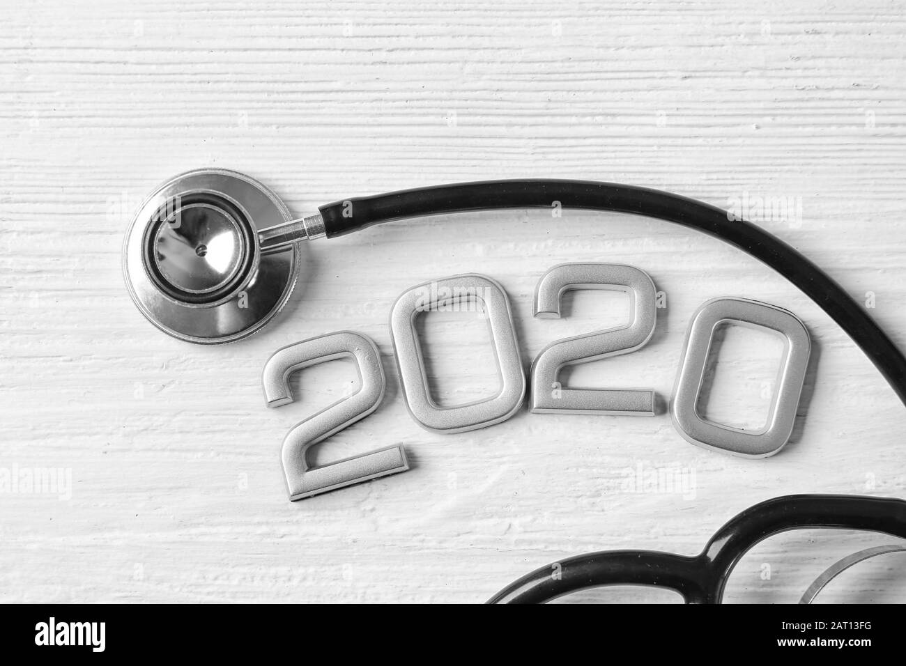 Stethoscope and figure 2020 on white wooden background Stock Photo - Alamy