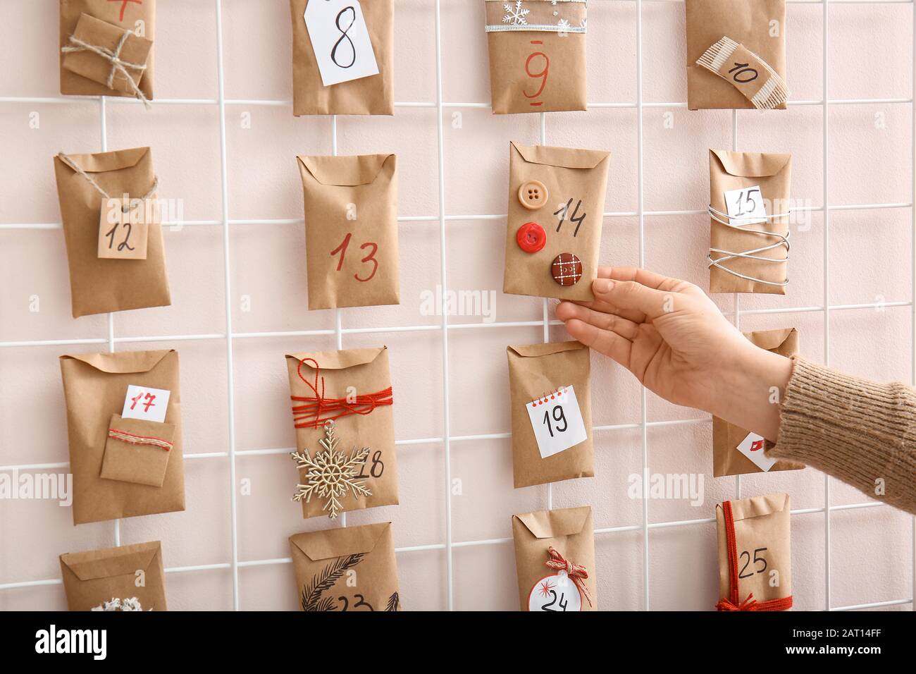 Woman making Christmas advent calendar Stock Photo - Alamy