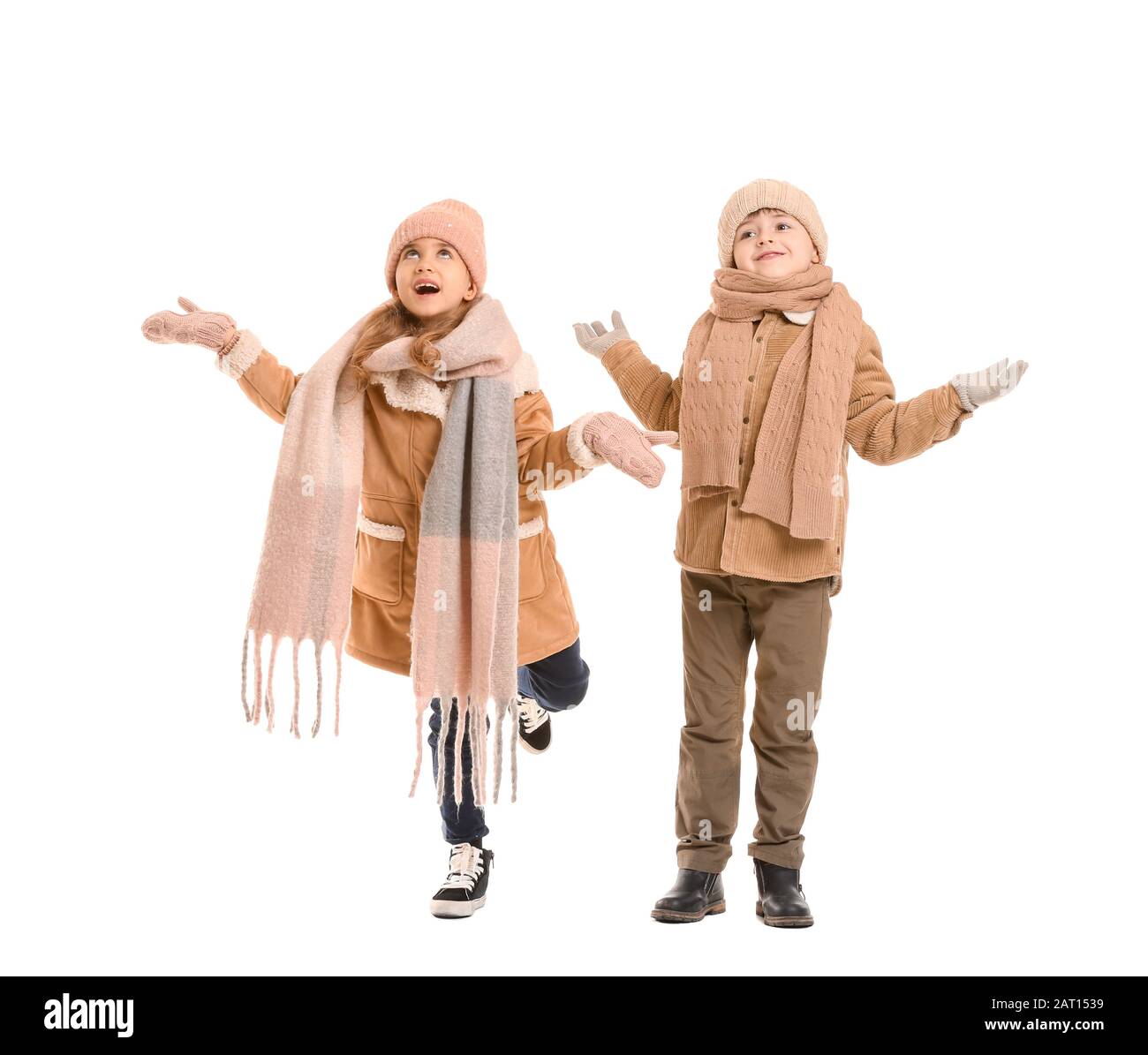 Little children in winter clothes on white background Stock Photo - Alamy