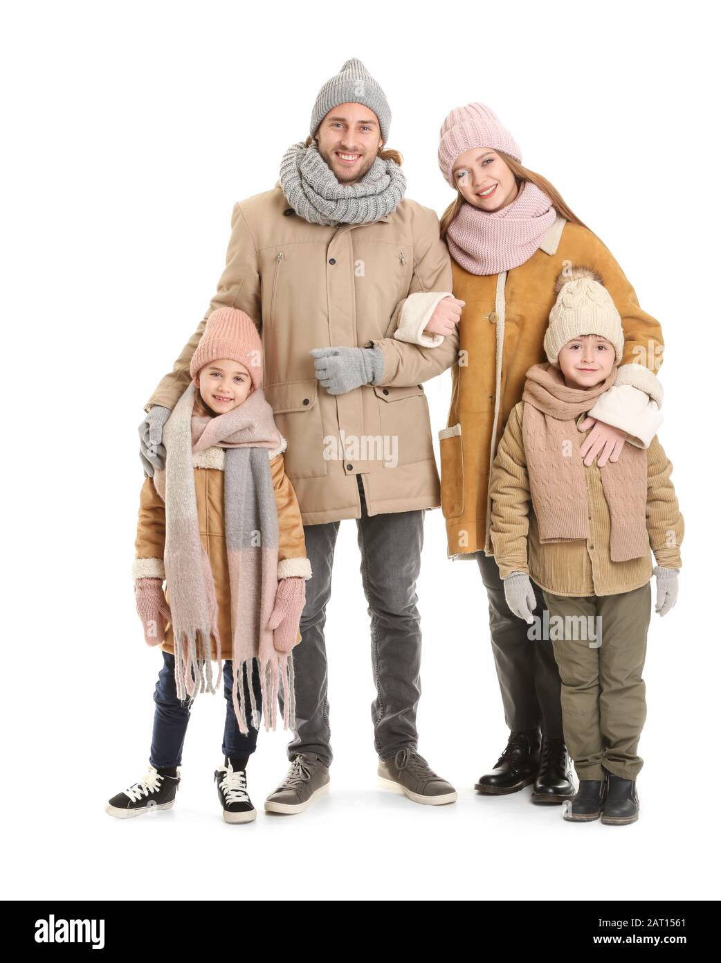 Happy family in winter clothes on white background Stock Photo - Alamy
