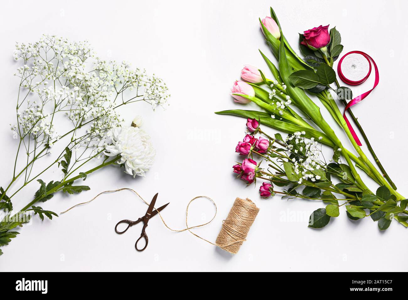 Supplies of florist with fresh flowers on white background Stock Photo ...