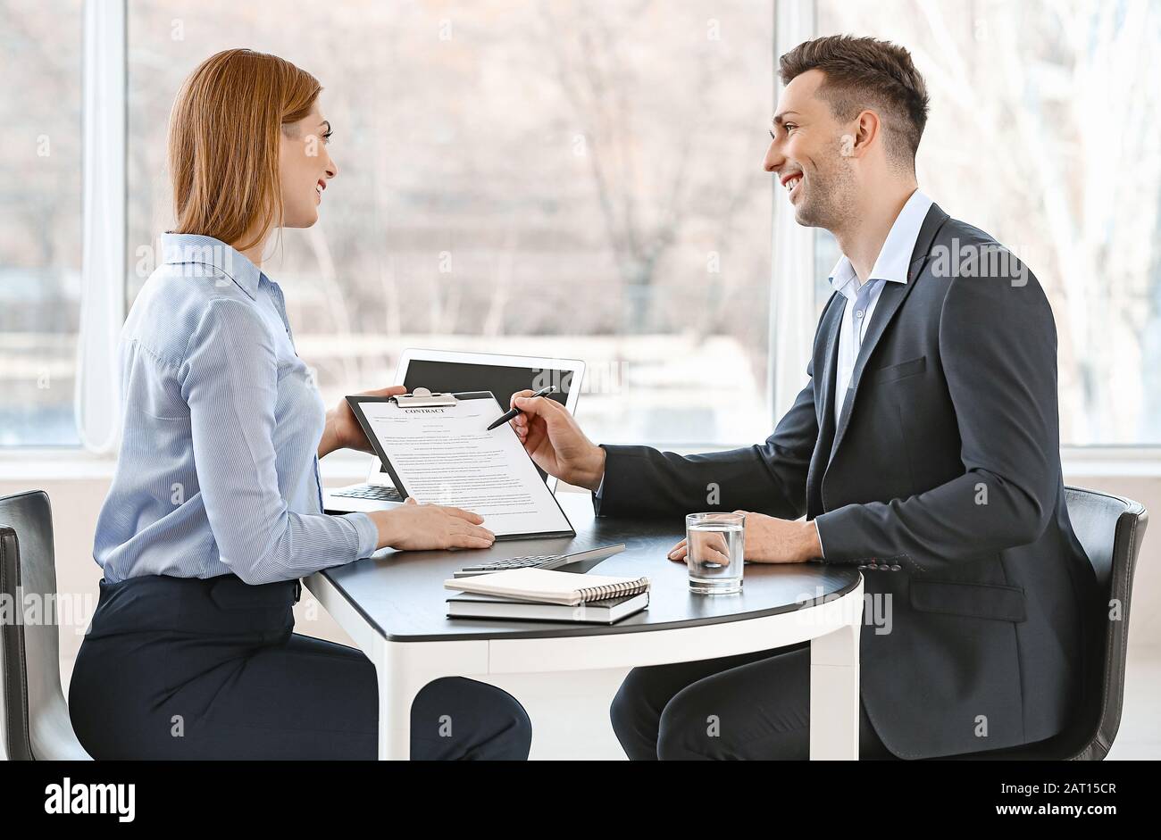 Bank manager working with man in office Stock Photo - Alamy