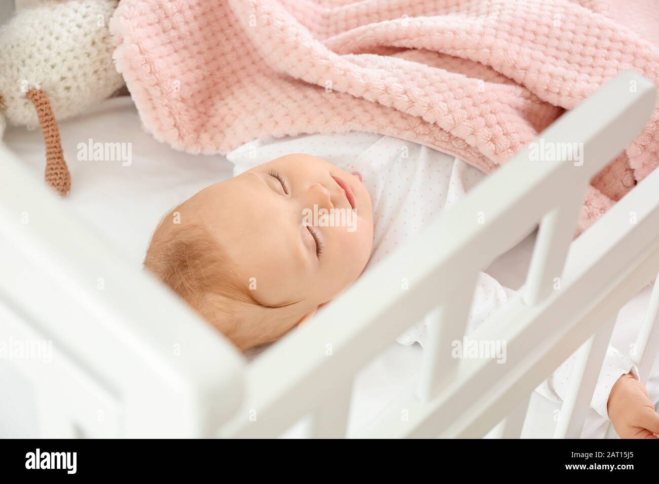 Little baby sleeping in bed Stock Photo - Alamy