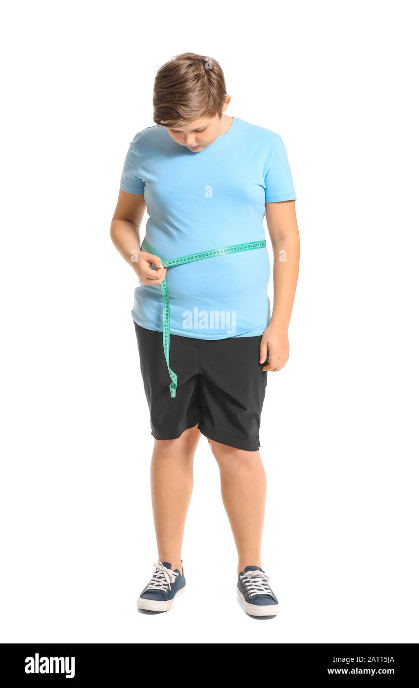 Overweight boy measuring his waist on white background Stock Photo - Alamy