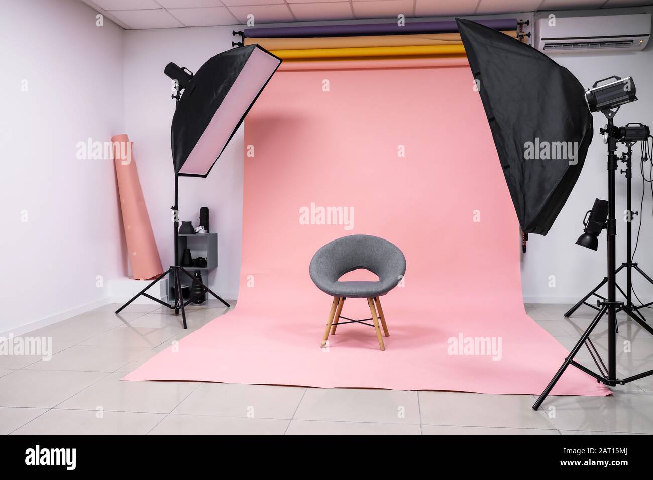 Chair and equipment in modern photo studio Stock Photo - Alamy