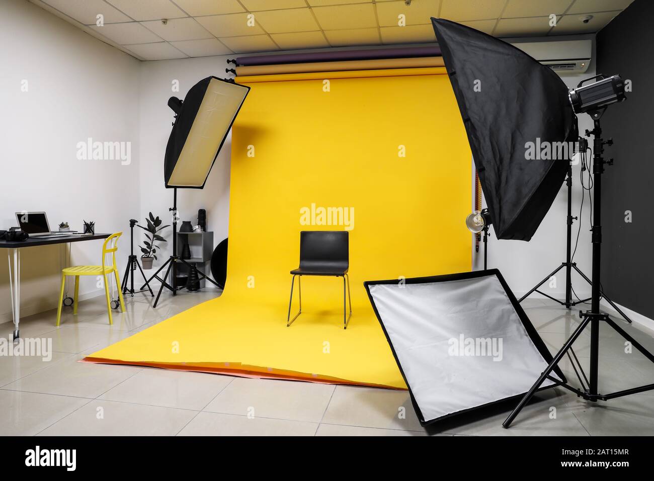 Chair and equipment in modern photo studio Stock Photo - Alamy